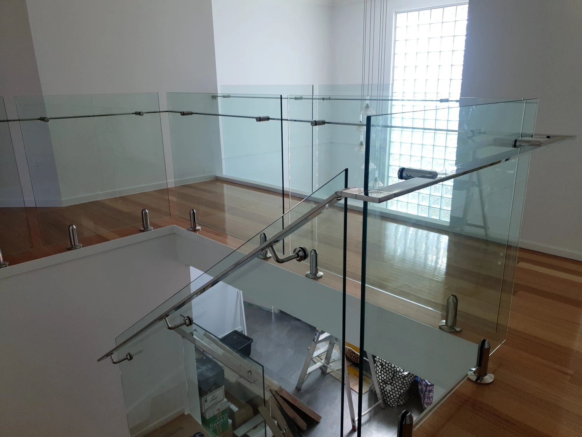 Glass balustrade with handrails off the side