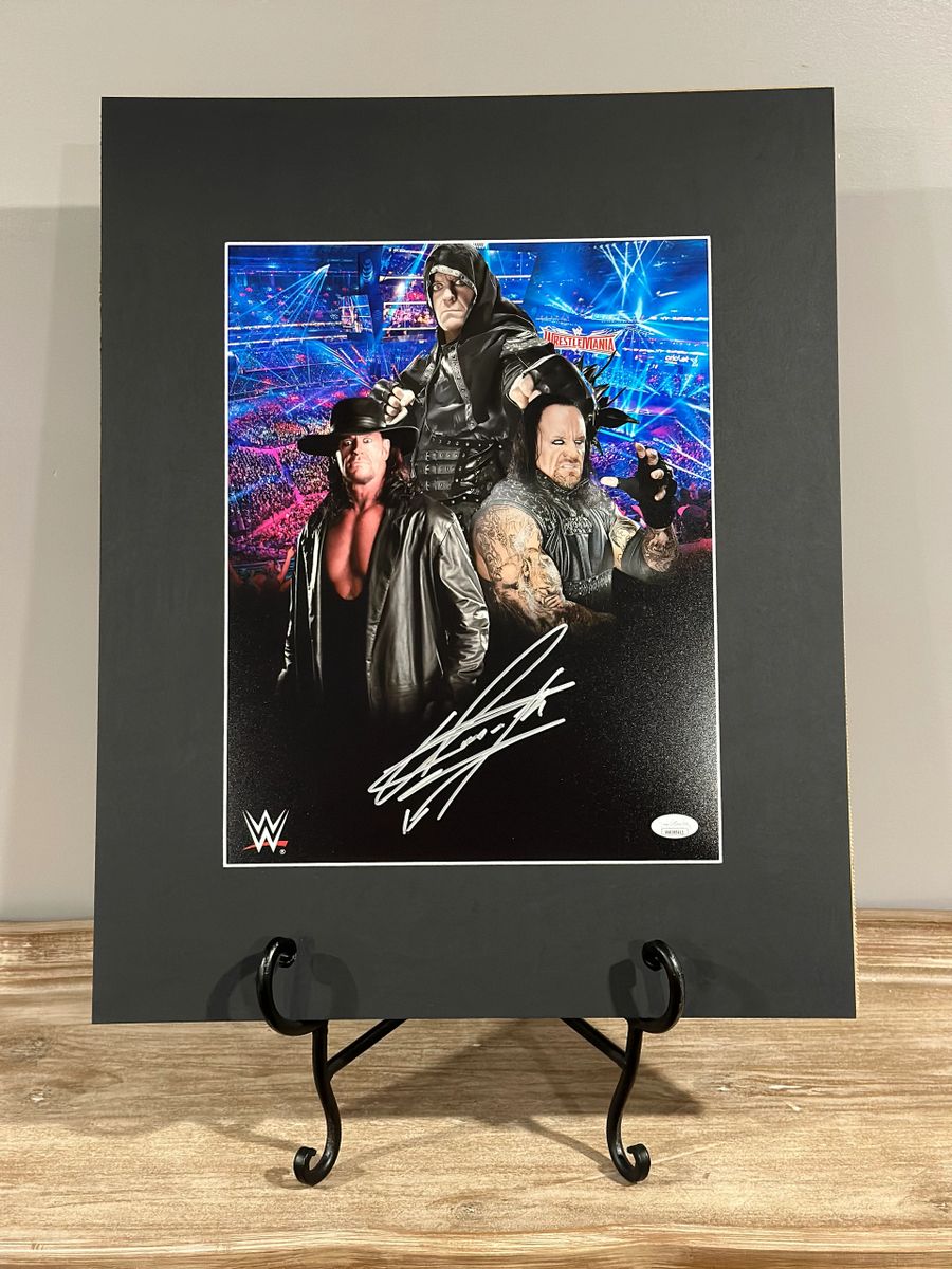 The Undertaker Signed WWE 11x14 Photo (Black Matting)
