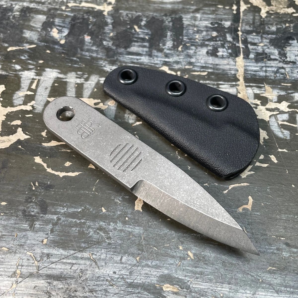 Titanium thumb knives