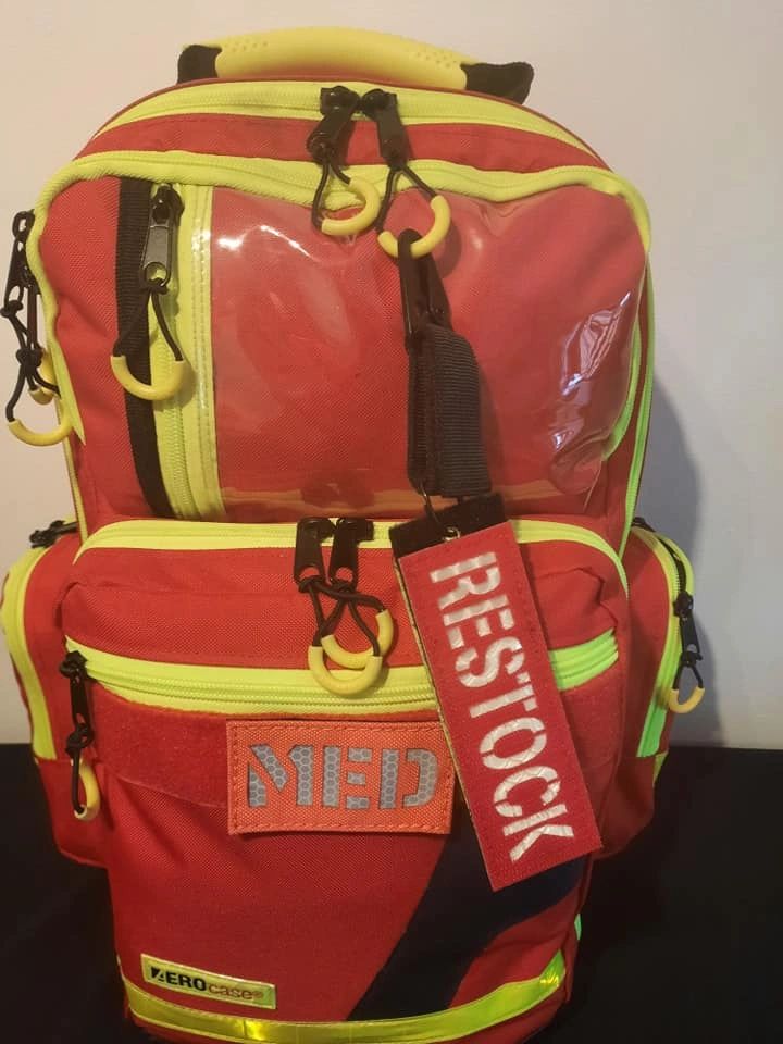 Medical backpack, red, with 5 pouches, supplied unkitted.