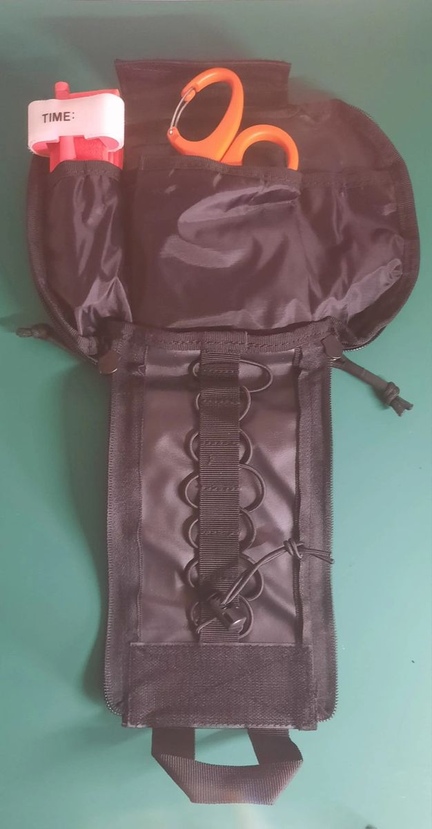 Black folding MOLLE medic pouch, can also be belt mounted.