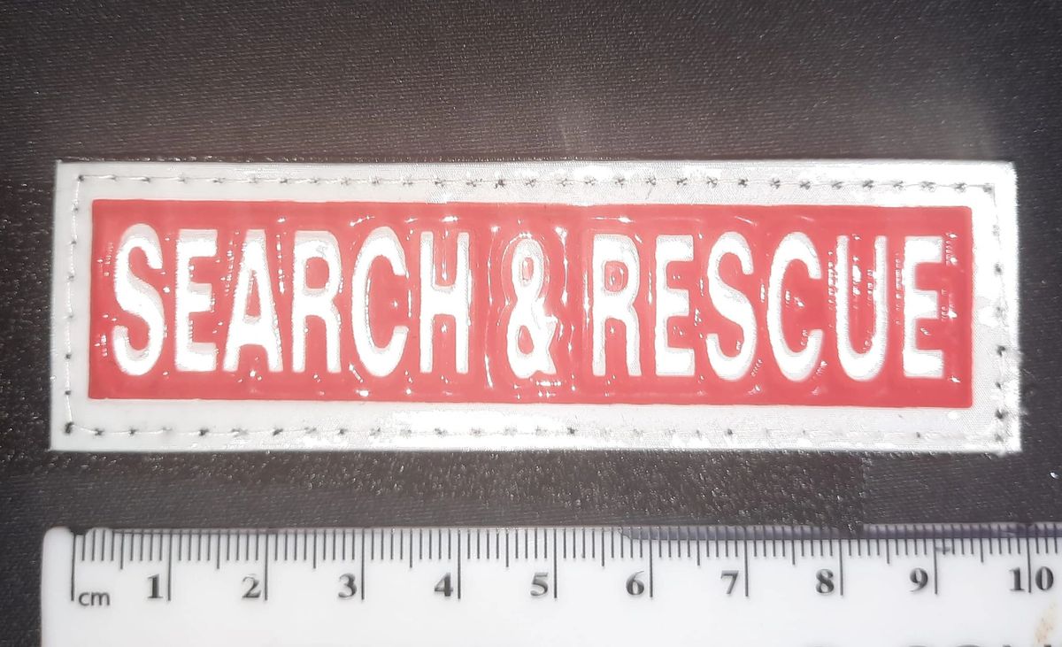 Red SEARCH & RESCUE reflective velcro patch. 10X3 cm