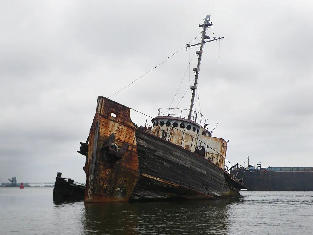 Men and Ships Rot in Port