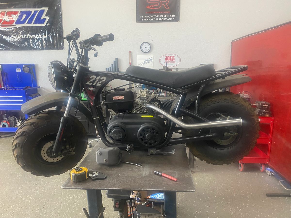 Mega Moto 212 left low side exit with brace (no trumpet)