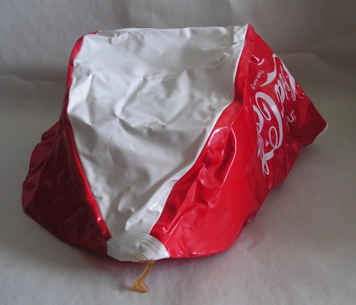 Coca Cola Promotional Inflatable Beach Ball and Evian Water inflatable.