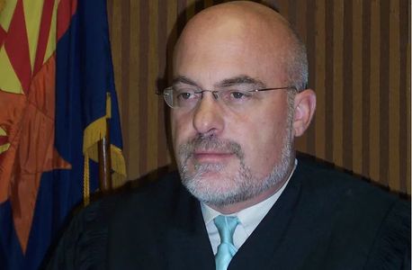 Adam Watters as Justice of the Peace