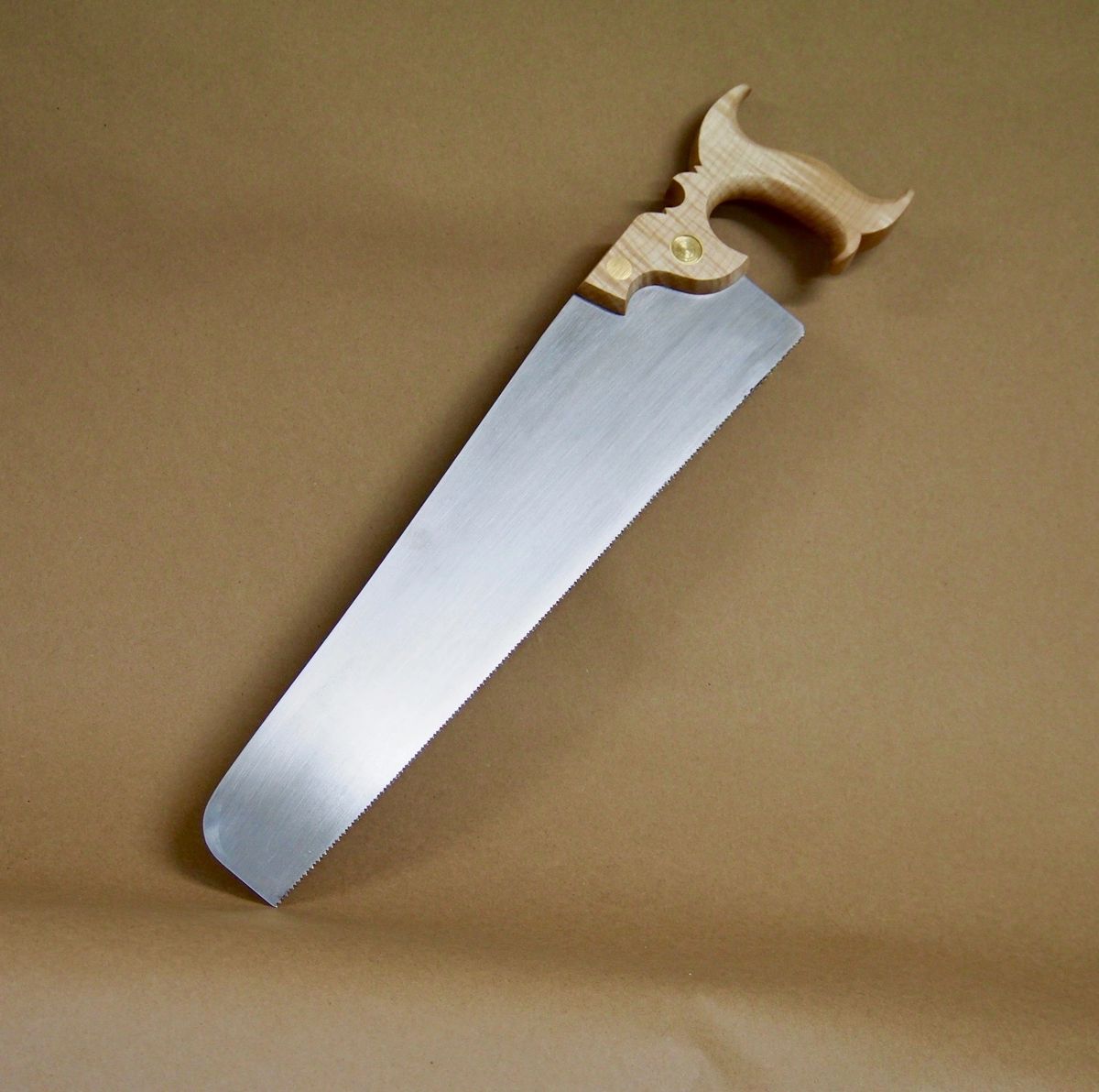 Small bench saw with pistol grip handle