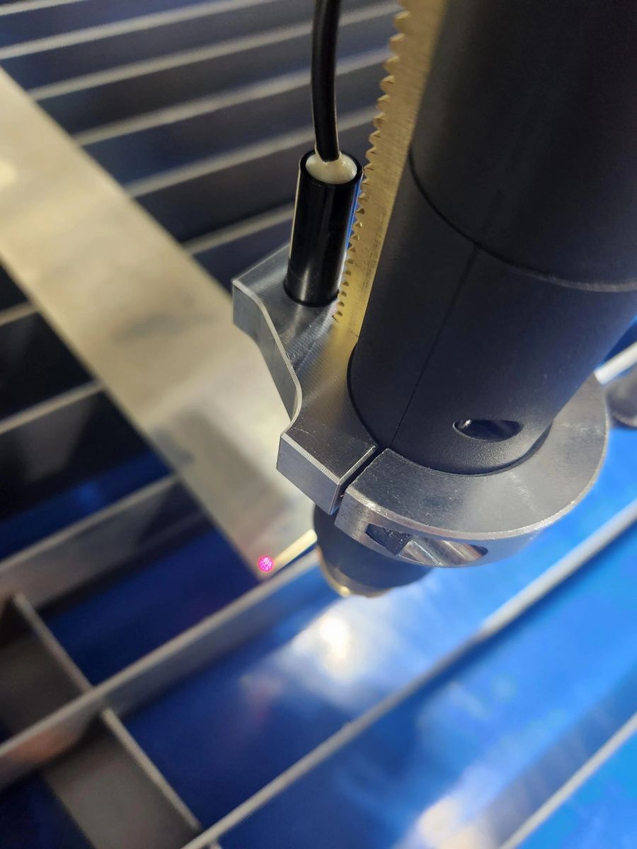 Torch mounted laser pointer