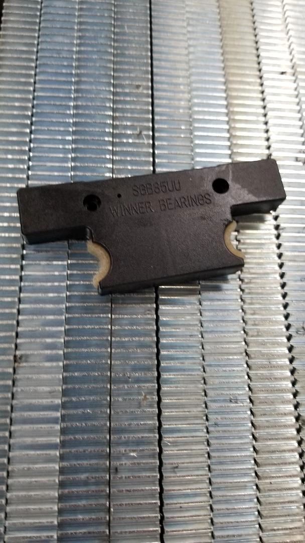 Wiper/scraper for long axis black rail truck