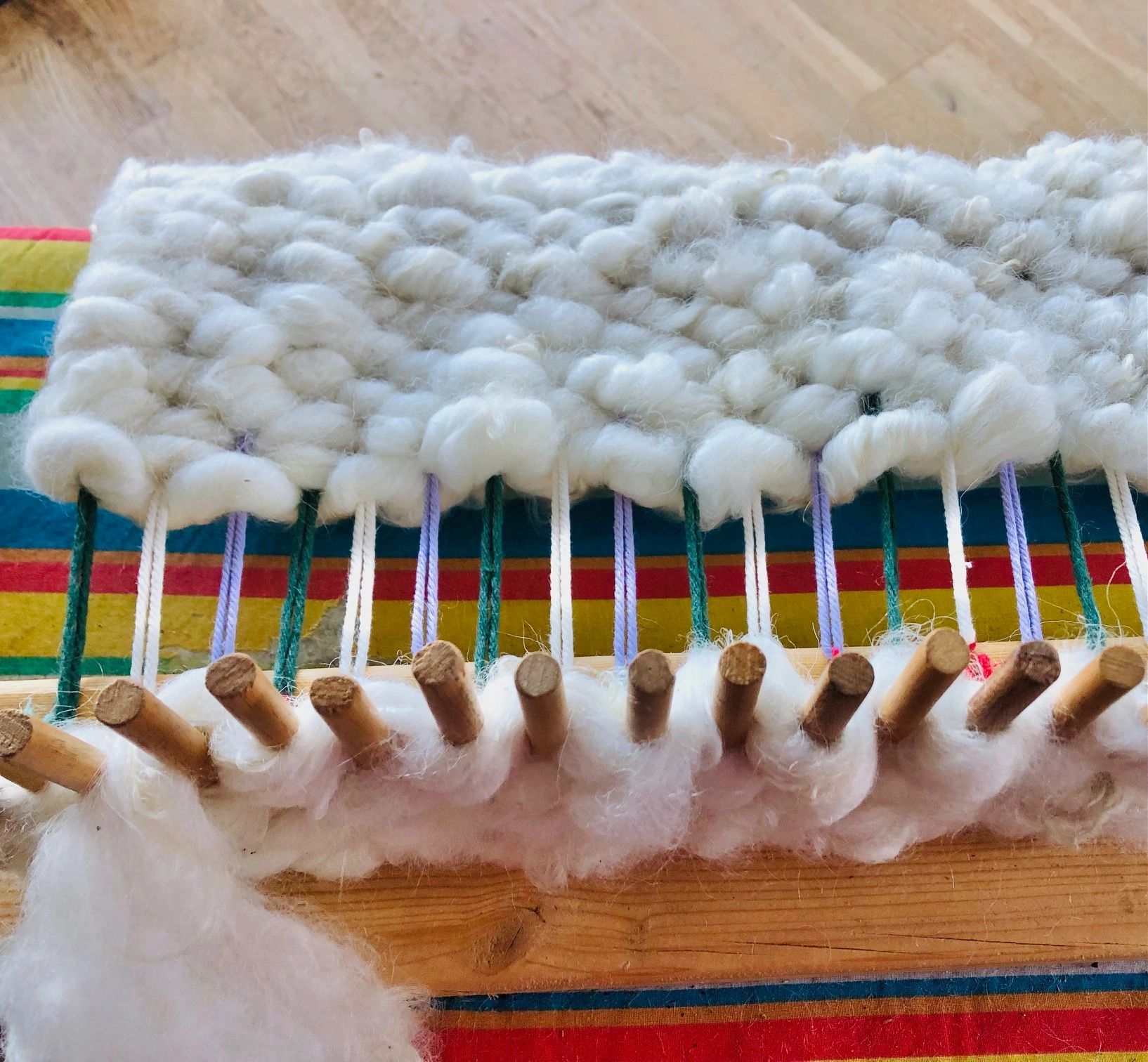 Peg Loom Weaving using sheep's fleece