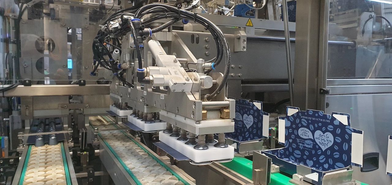 Baumann Packaging Systems - Packaging Machine, Cross Web Labellers