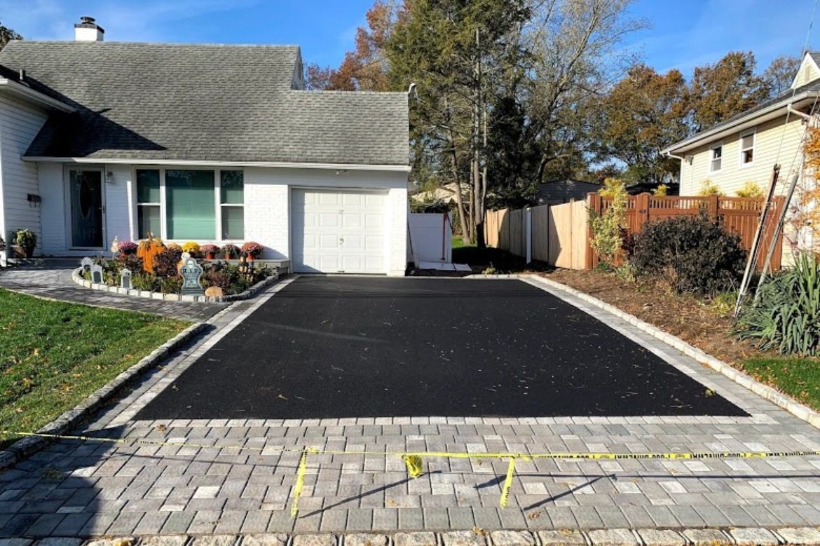 What is the purpose of Driveways with a strip of pavers blocks near the ...