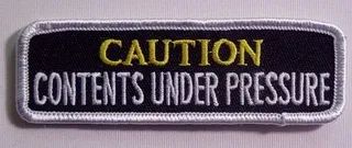 CAUTION: CONTENTS UNDER PRESSURE