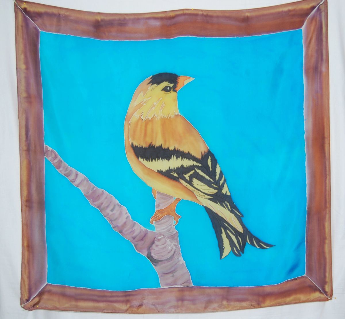 American Goldfinch blue background