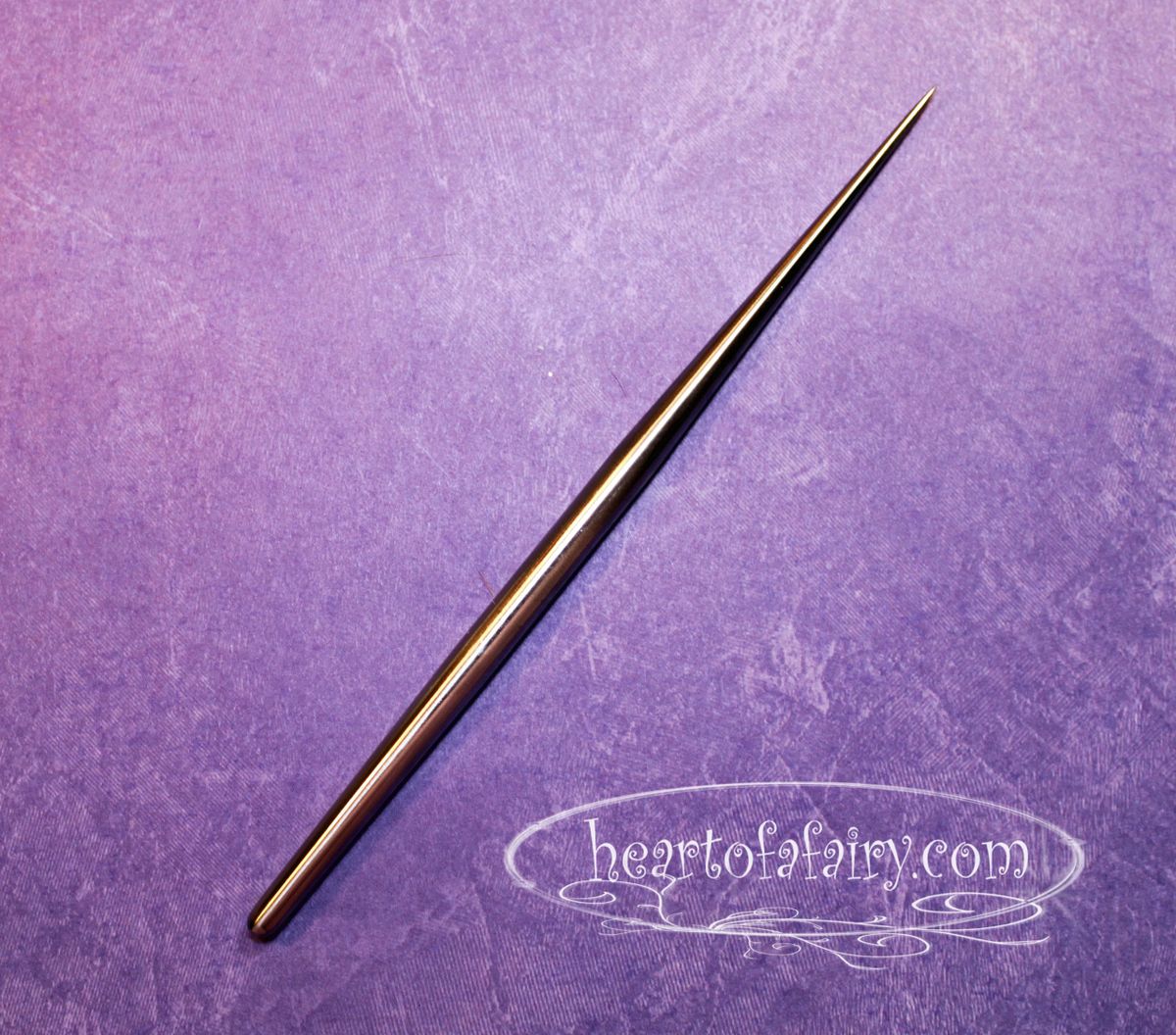 Round stainless steel sculpting tool