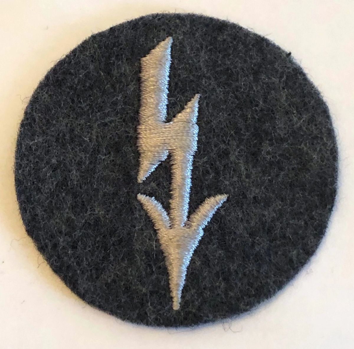WW2 German Luftwaffe Signals trade badge in mint unissued condition.