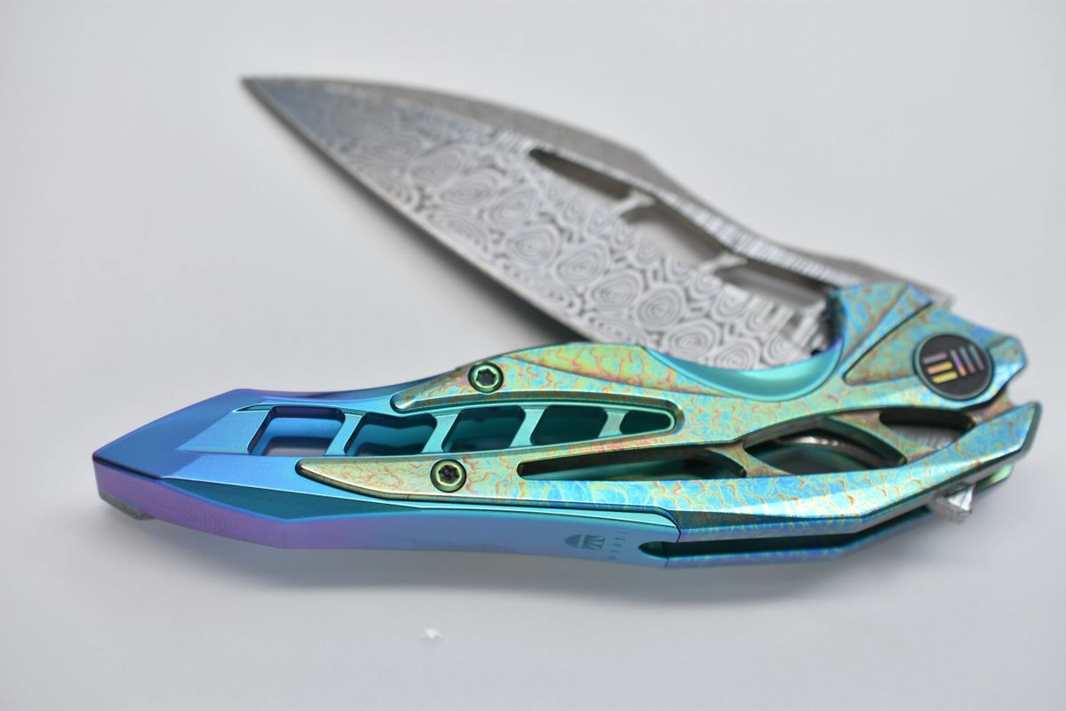 WE Arrakis Damasteel: Custom buffed and anodized with a teal and green ...