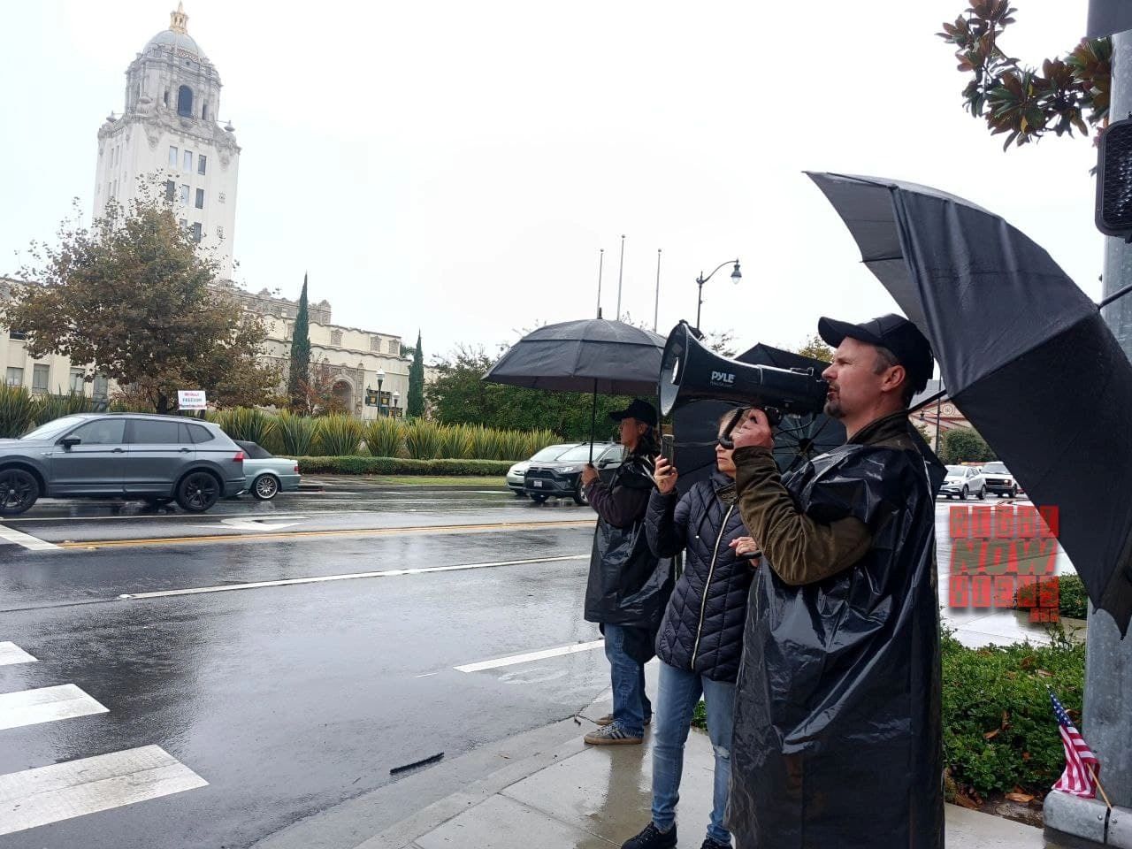Protesters Stand in Pouring Rain in Support of First Responders