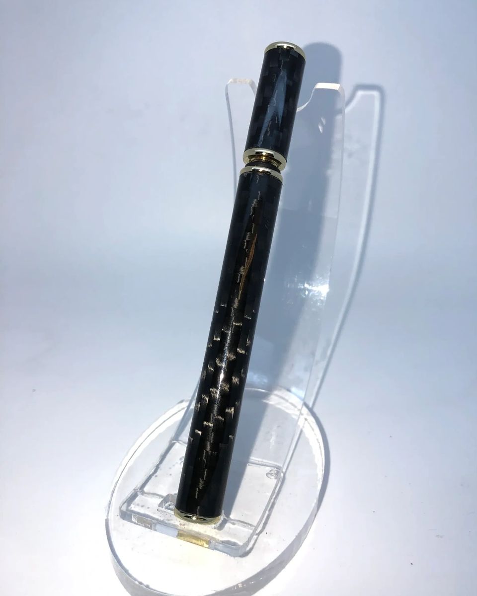 Carbon fibre perfume pen.