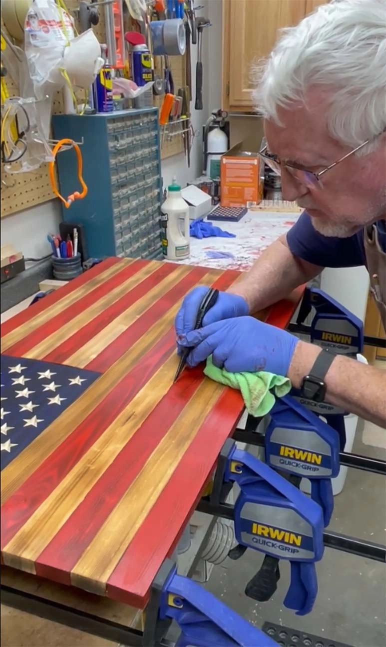 Cleaning a flag after gluing.