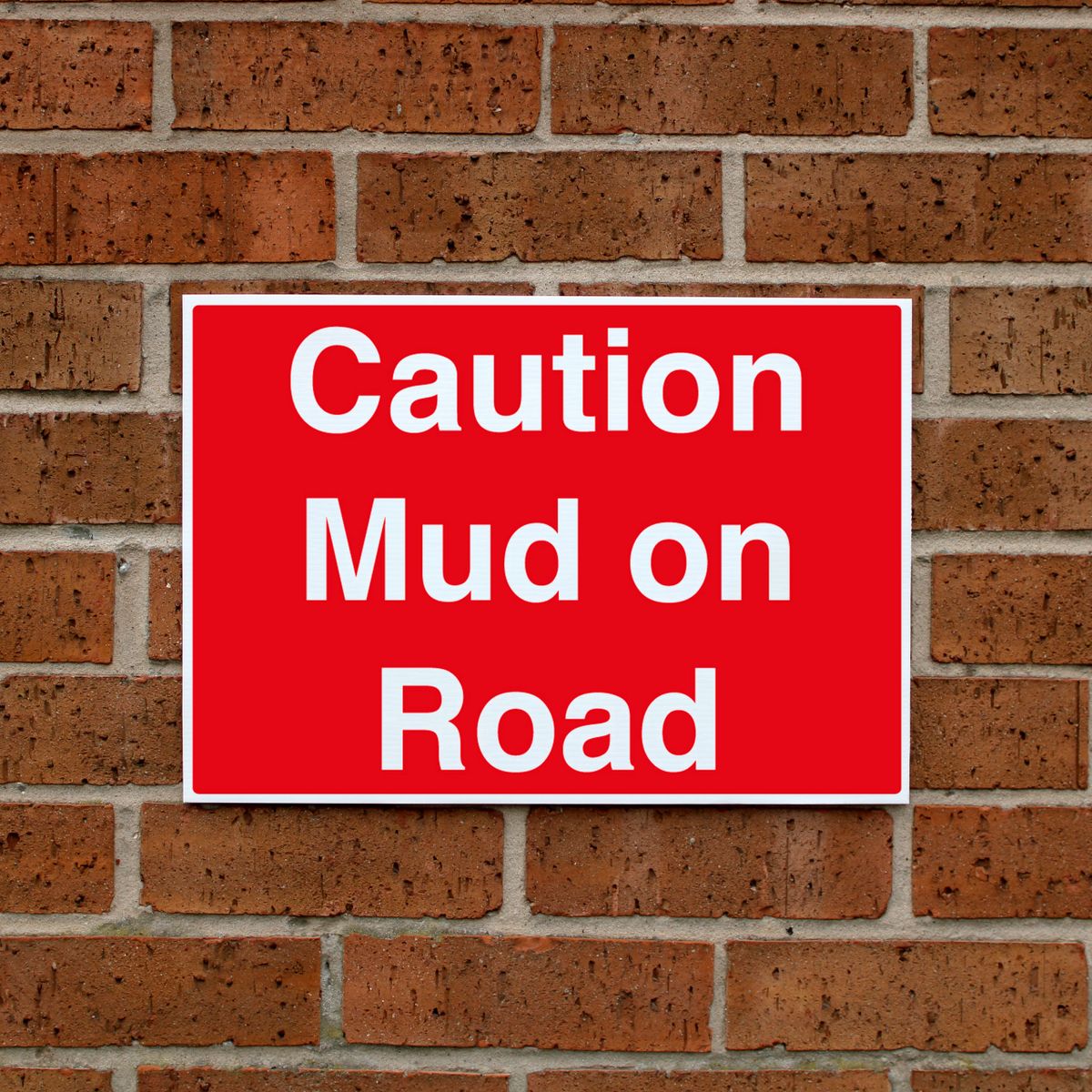 Caution Mud On Road Sign