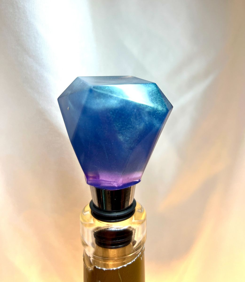 Large facet metallic blue stopper
