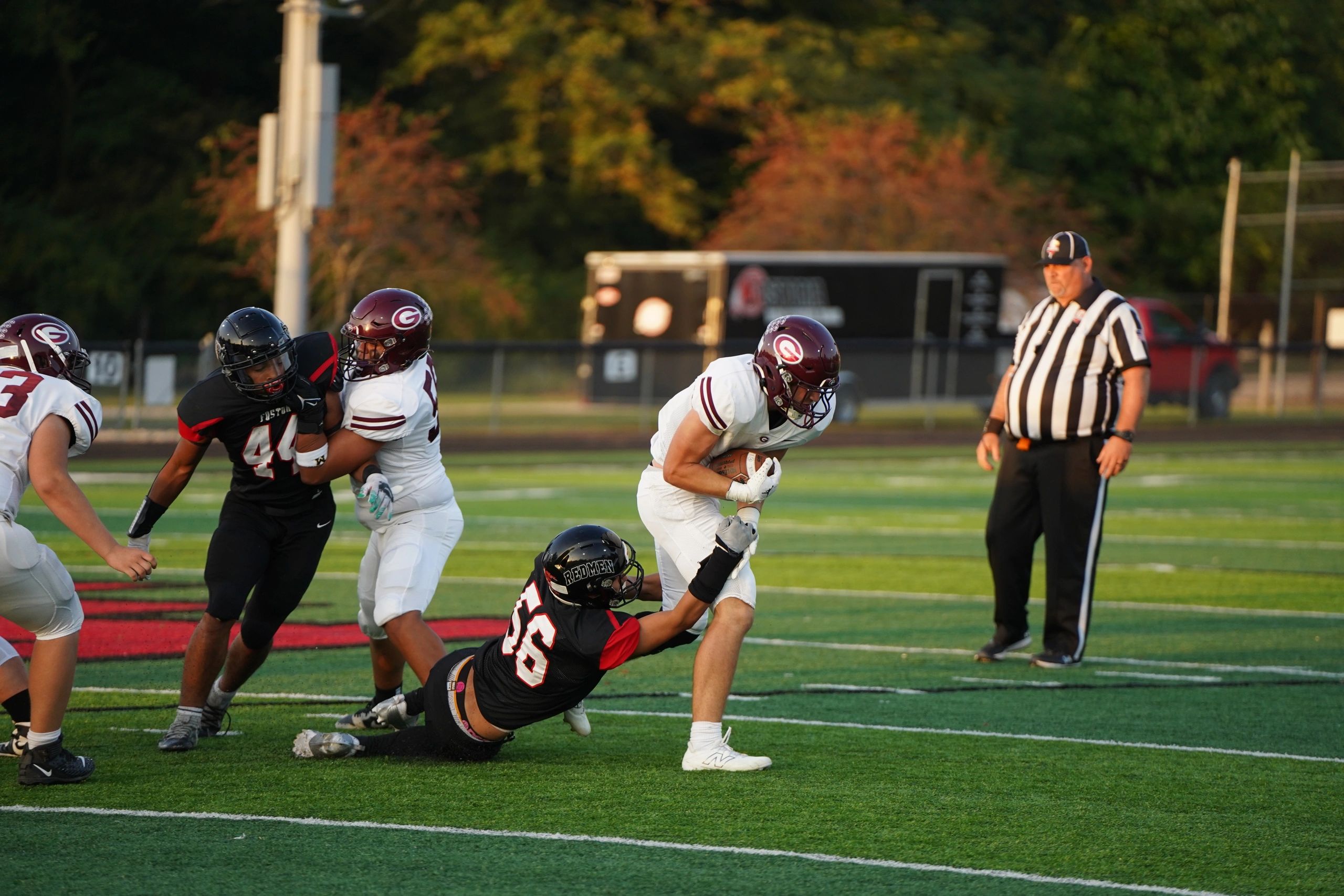 Genoa Comets Dominate Fostoria Redmen with 47-7 Victory