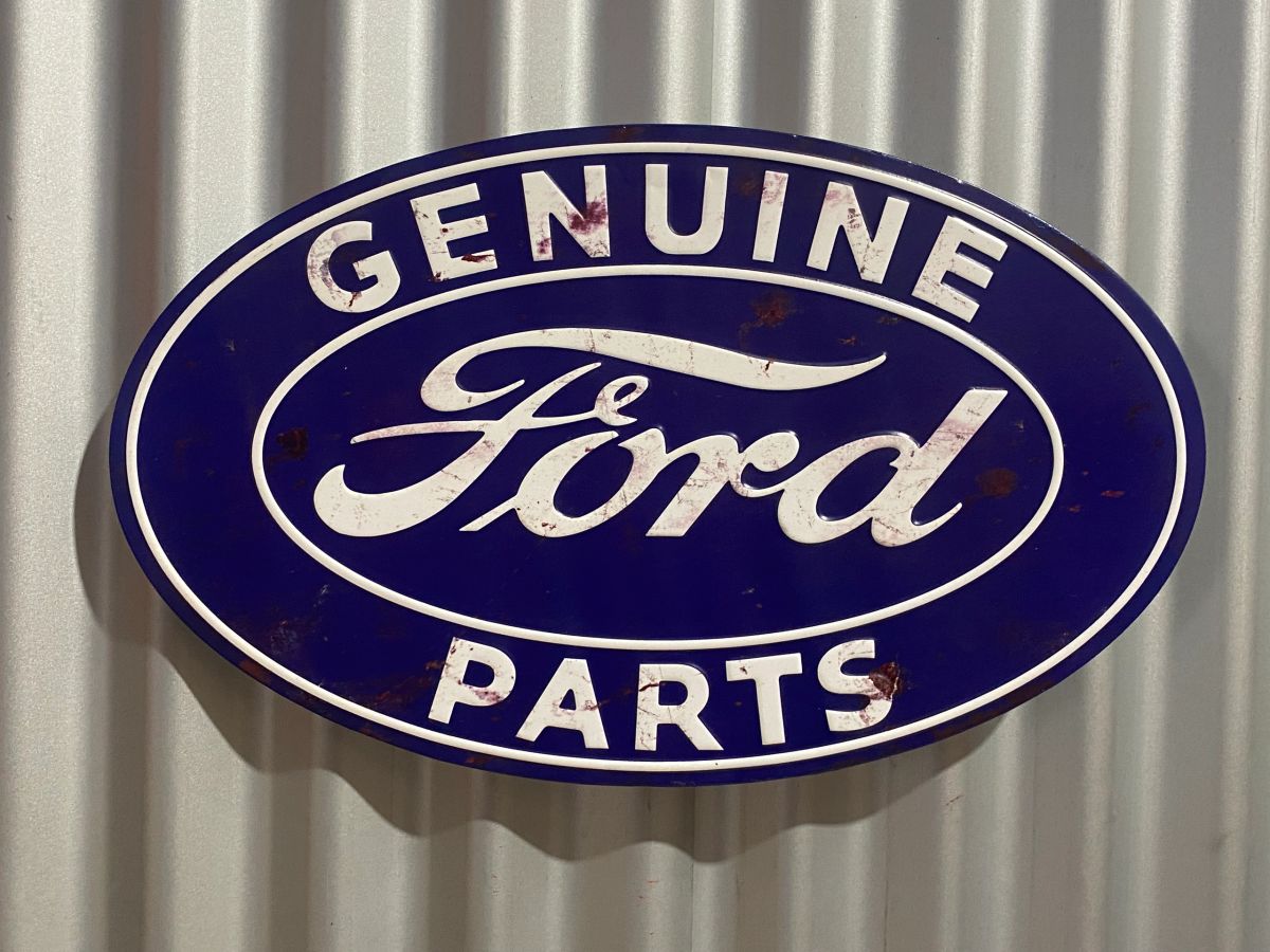 FORD GENUINE PARTS OVAL EMBOSSED METAL SIGN