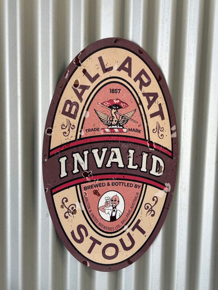 BALLARAT INVALID STOUT OVAL METAL SIGN 610 MM X 360 MM