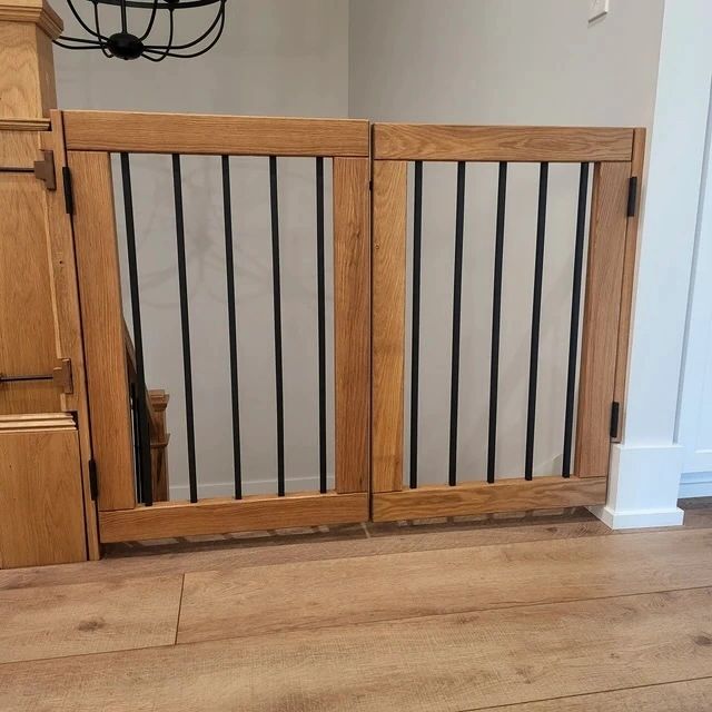 Double door pet gate or baby gate with vertical balusters newel mounted