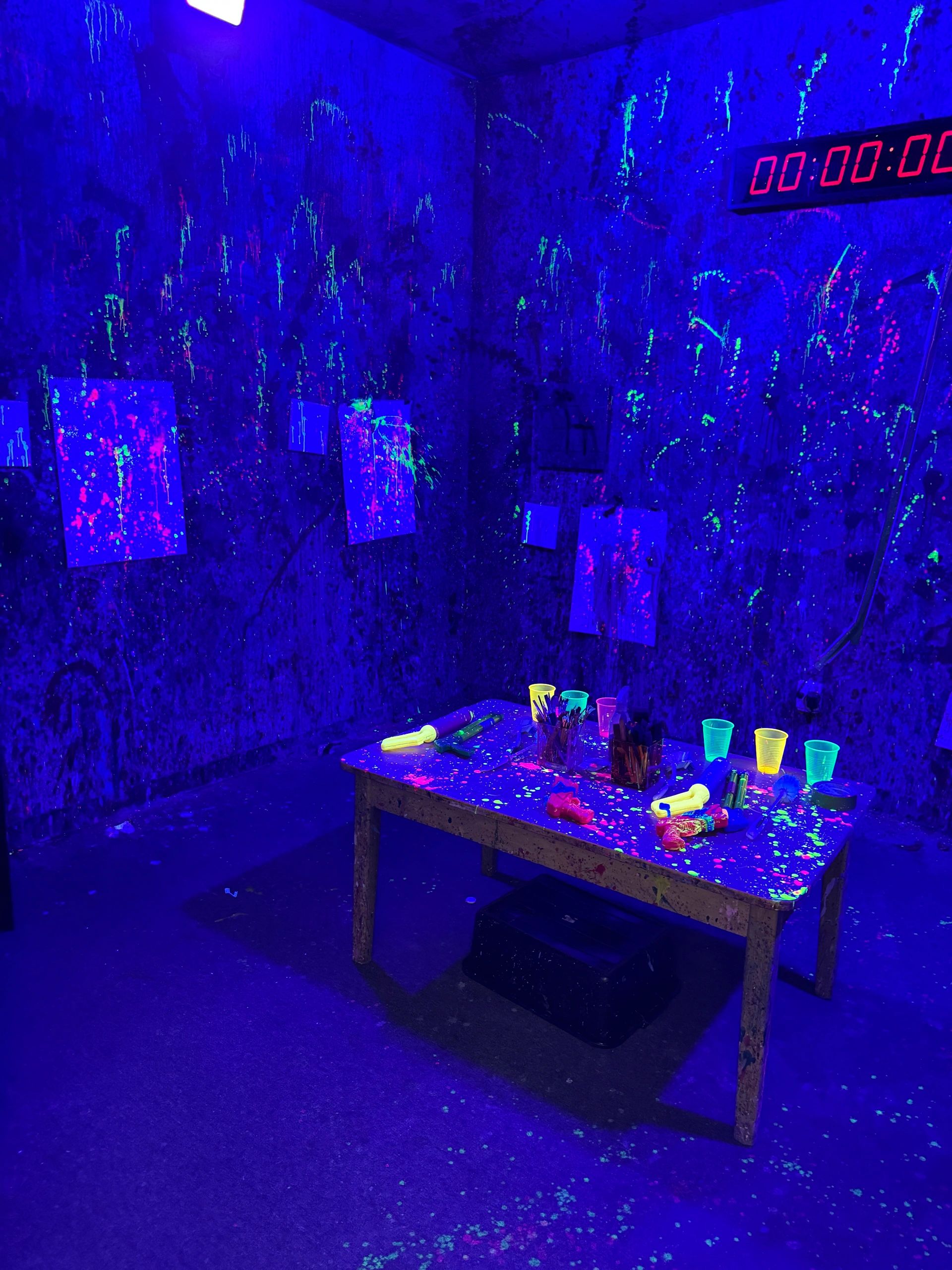 Black light splatter painting session