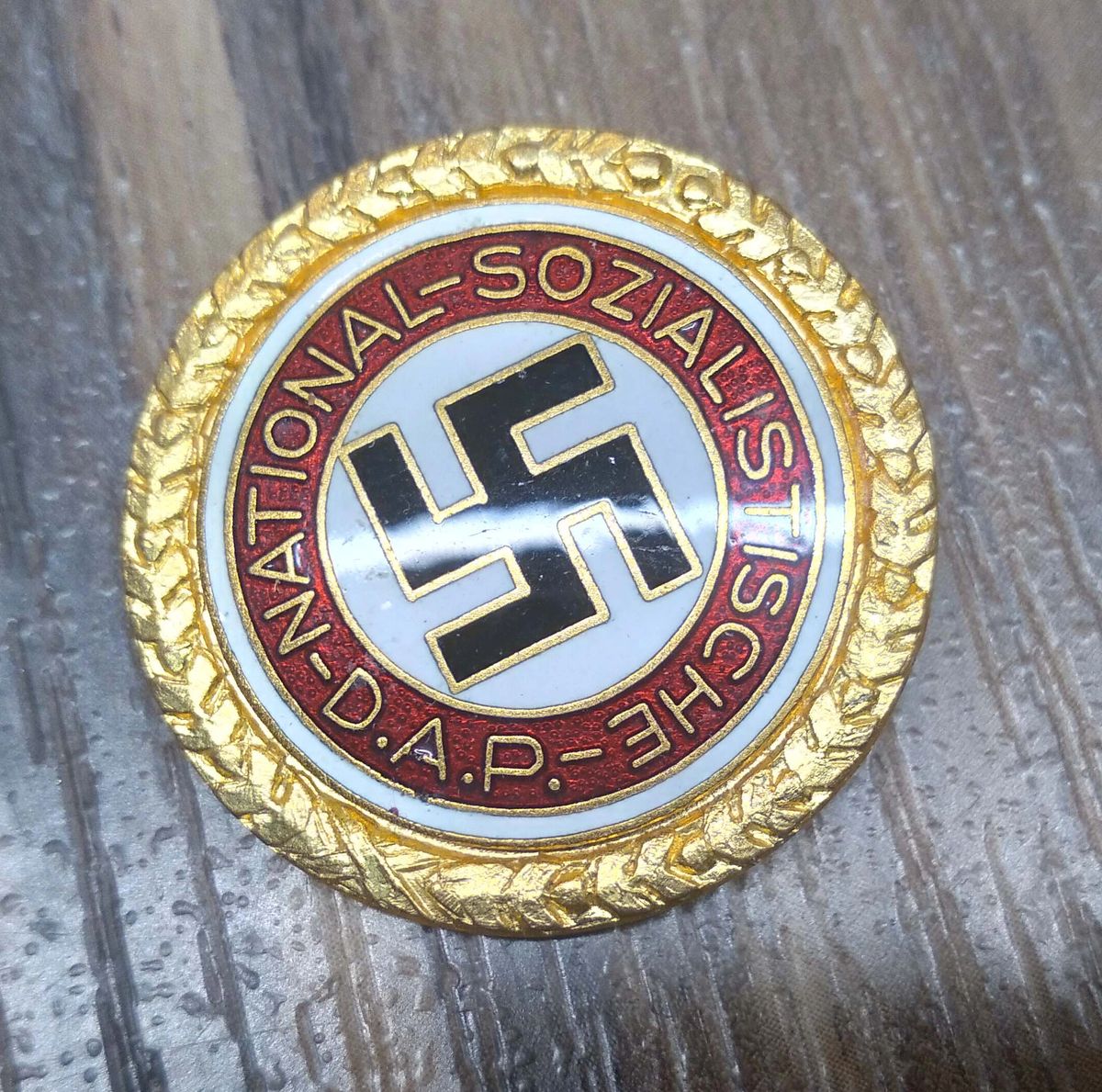 SOLD - REPRODUCTION WWII GERMAN GOLDEN NAZI PARTY BADGE, Item #6683