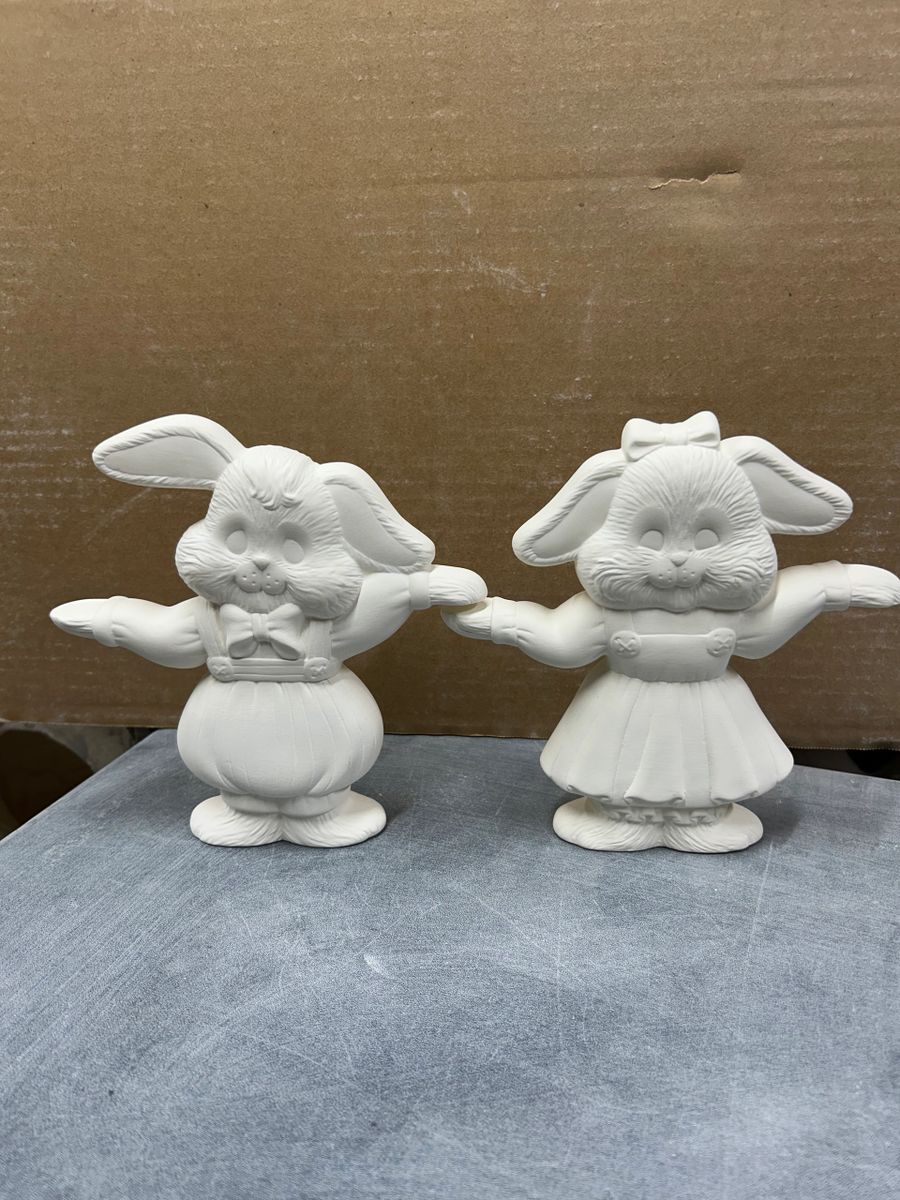 Bunny boy and girl hand in hand