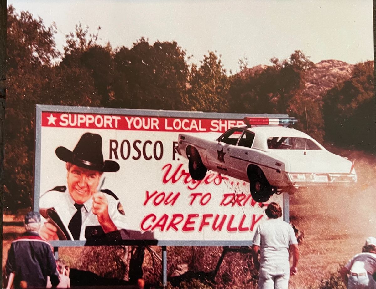 Rosco P. Coltrane Dukes of Hazzard crash thru the sign