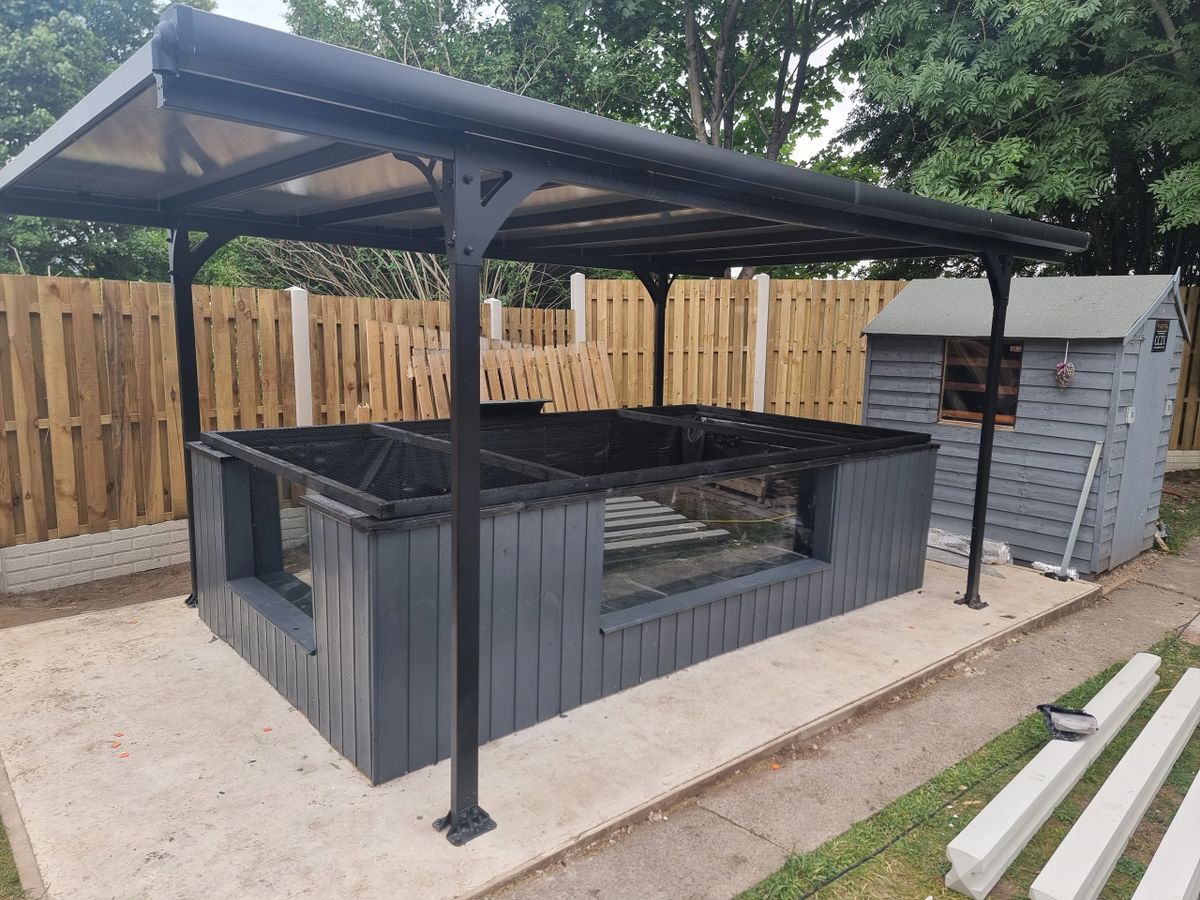 Grey pond with 2 viewing windows.