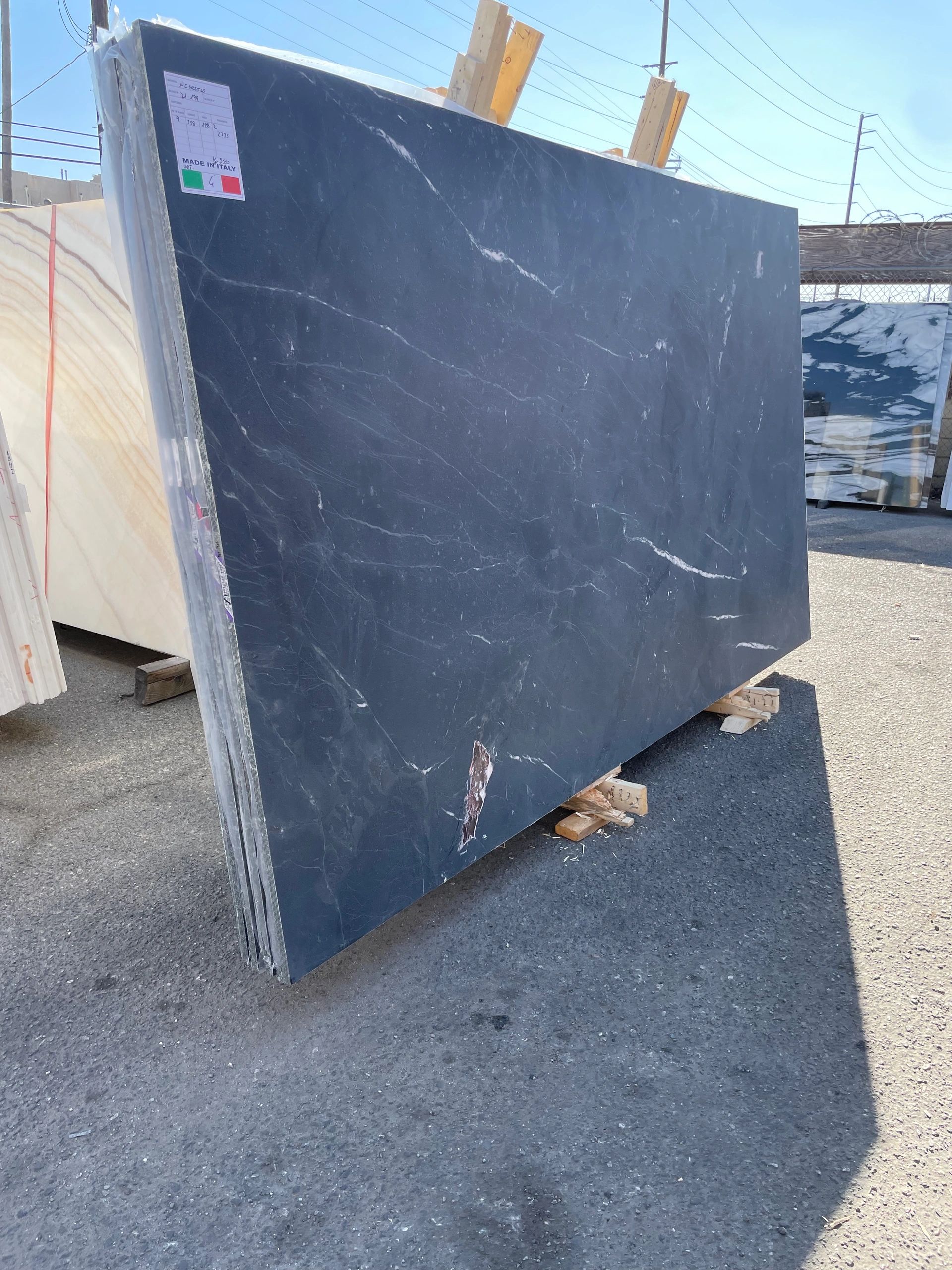 Leather finish dark black and white quartzite slabs in LA