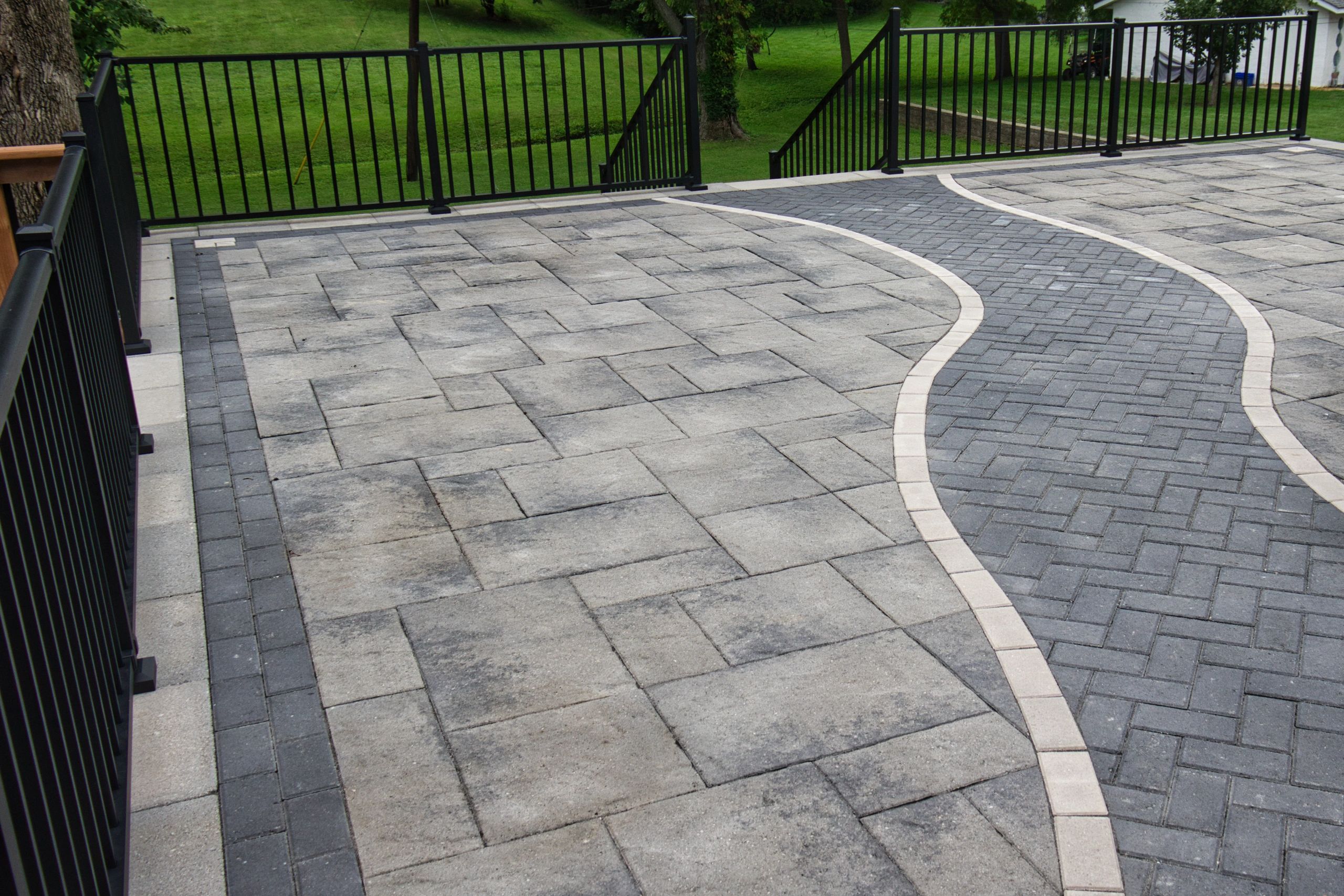 "Choosing Between Concrete Pavers and Stamped Stained Concrete: