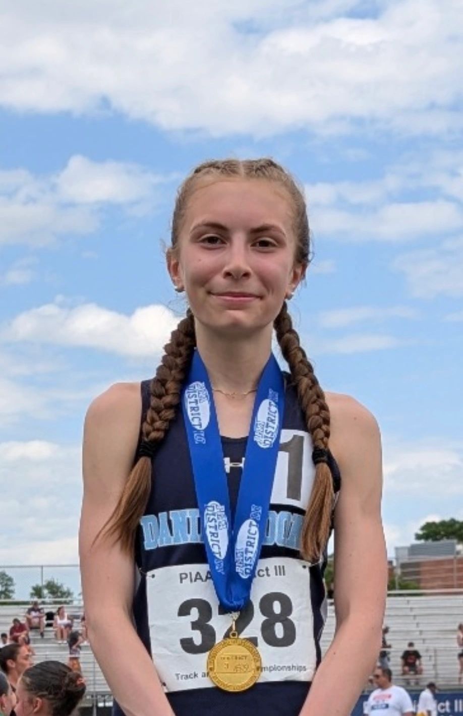 Julia Leady is 3200 Champion, BCIAA Wins 15 Other Medals