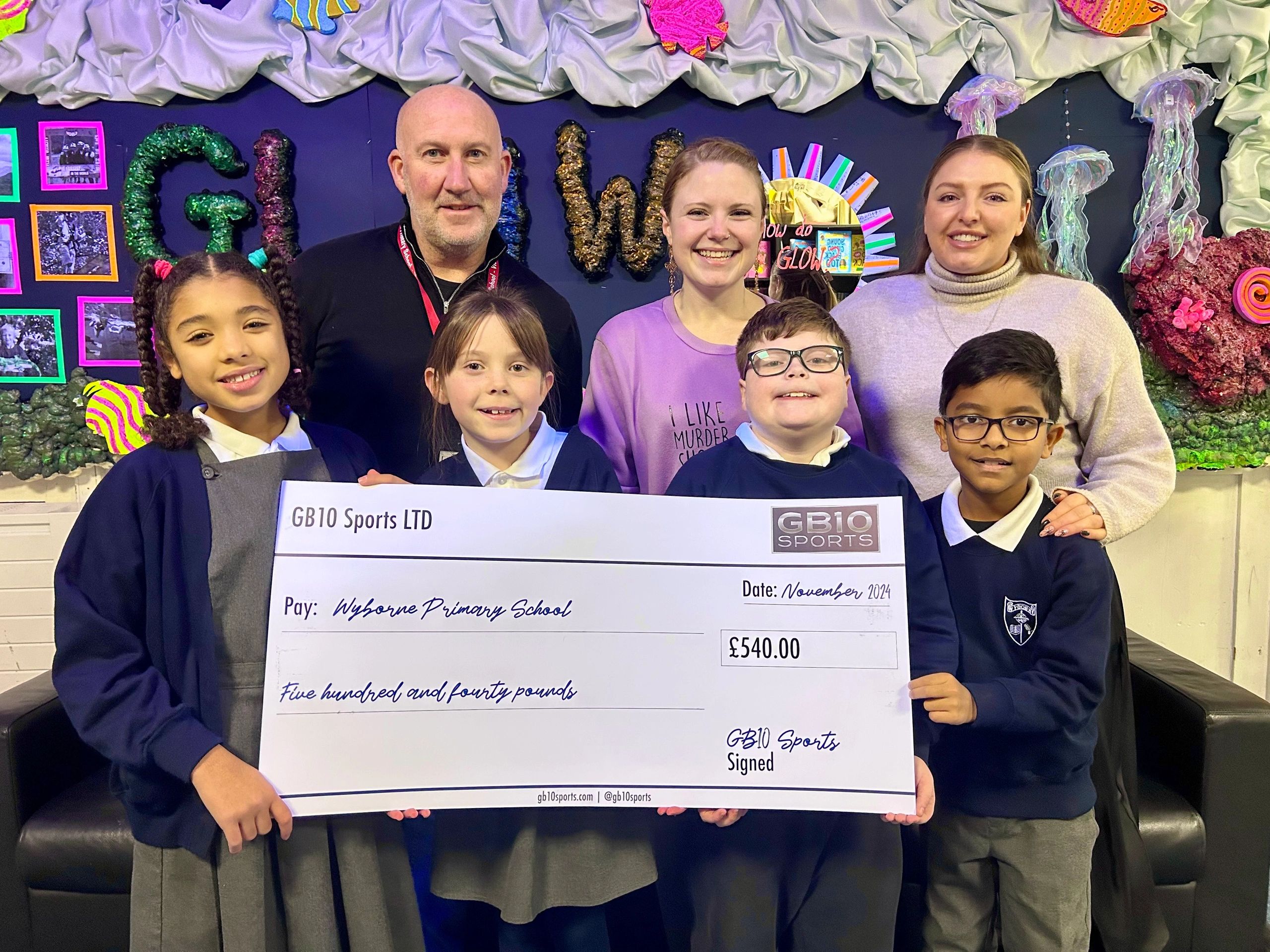 GB10 Sports present cheque to Wyborne Primary School
