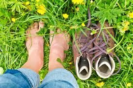 Grounding:How Placing Your Feet In The Grass Can Help With Stress