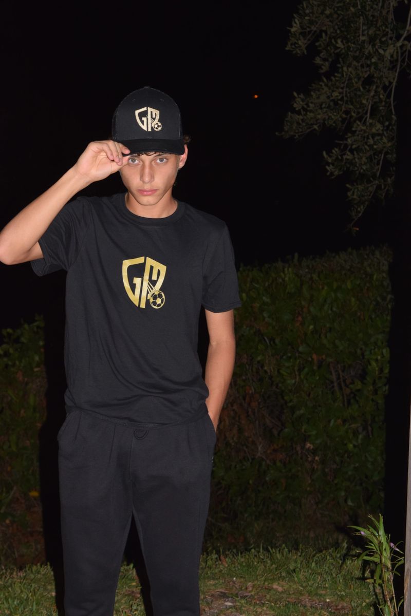 GET MEGGED BLACK AND GOLD HAT