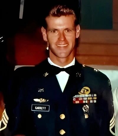 DOUGLAS T. GARRETT