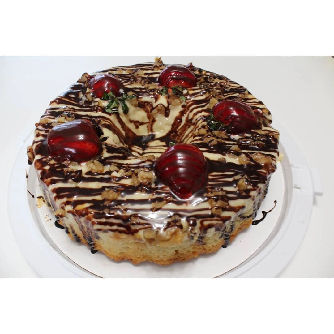 Flan Cake Topped with Strawberries and Chocolate