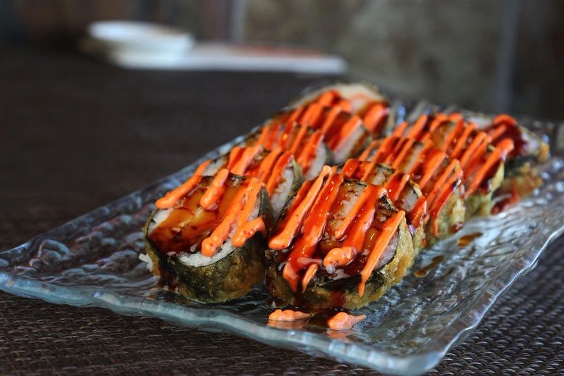 Godzilla (cooked) - Tempura tuna, yellowtail, and salmon, wrapped in ...