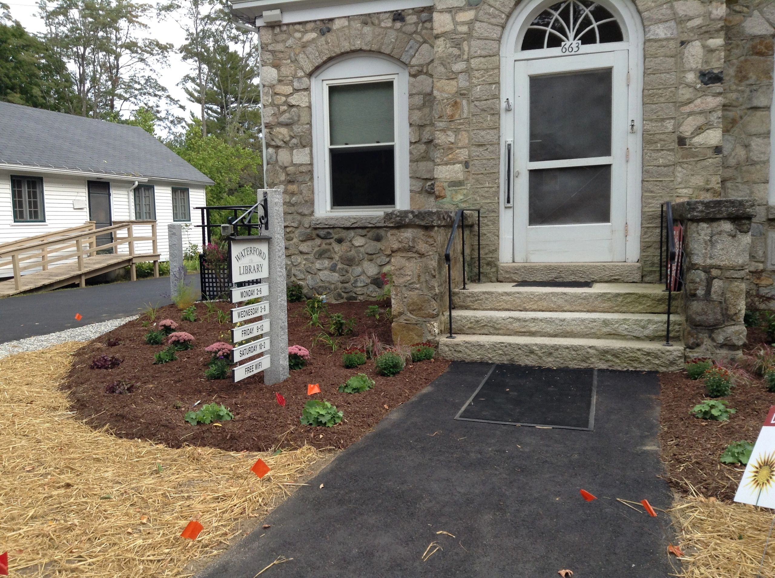 New ADA Accessible Door, Ramp, Driveway, and Landscaping.